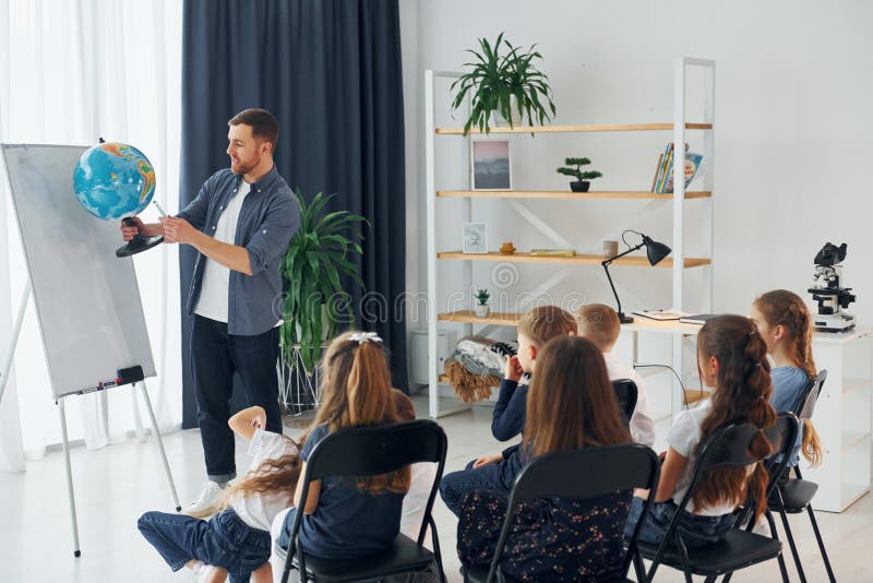 Geography Lesson. with Globe in Hands Stock Image - Image of group ...