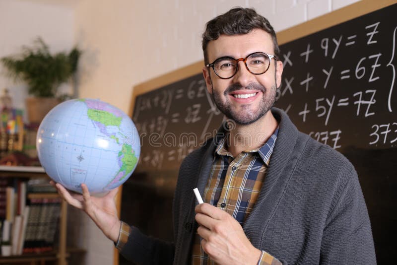 Geography Teacher Showing the Globe in Classroom Stock Image - Image of ...