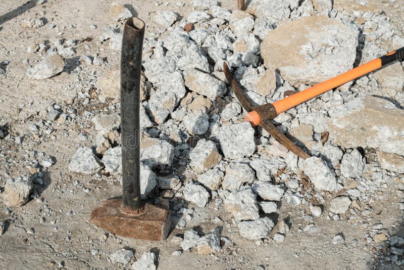 Geological Pick with Orange Handle on the Stones Next To Old Hammer ...