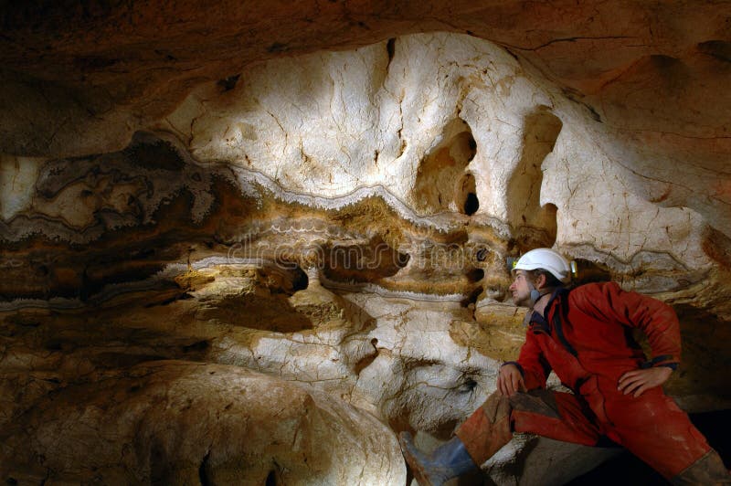 Geologist Spelunker Studying Mysterious Limestone Layers in a Cave ...