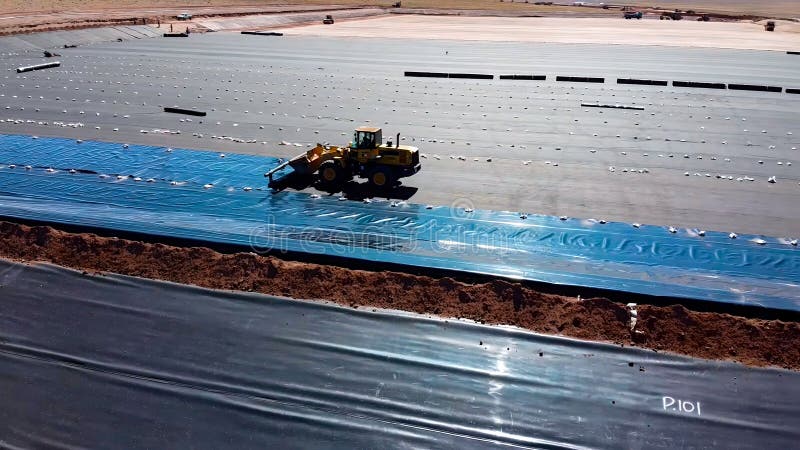 Geomembrane Deployment and Installation Process with Machinery in the ...