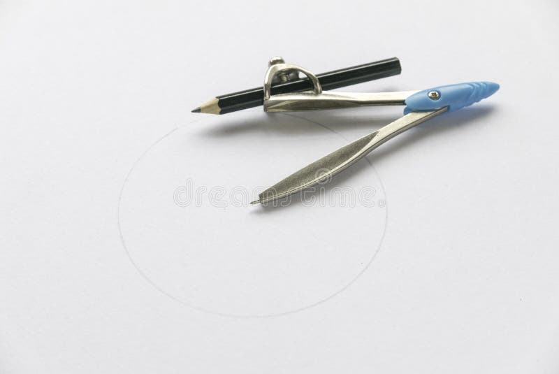 Geometric Compasses Drawing Circle on a White Paper Stock Image - Image ...