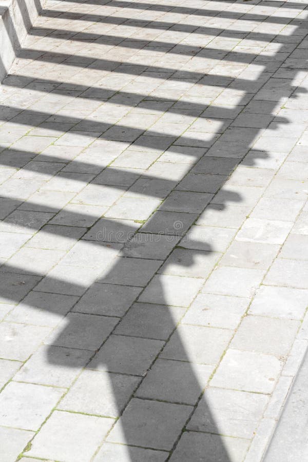 Geometric Diagonal Shadow from the Fence on the Path of Paving Slabs ...