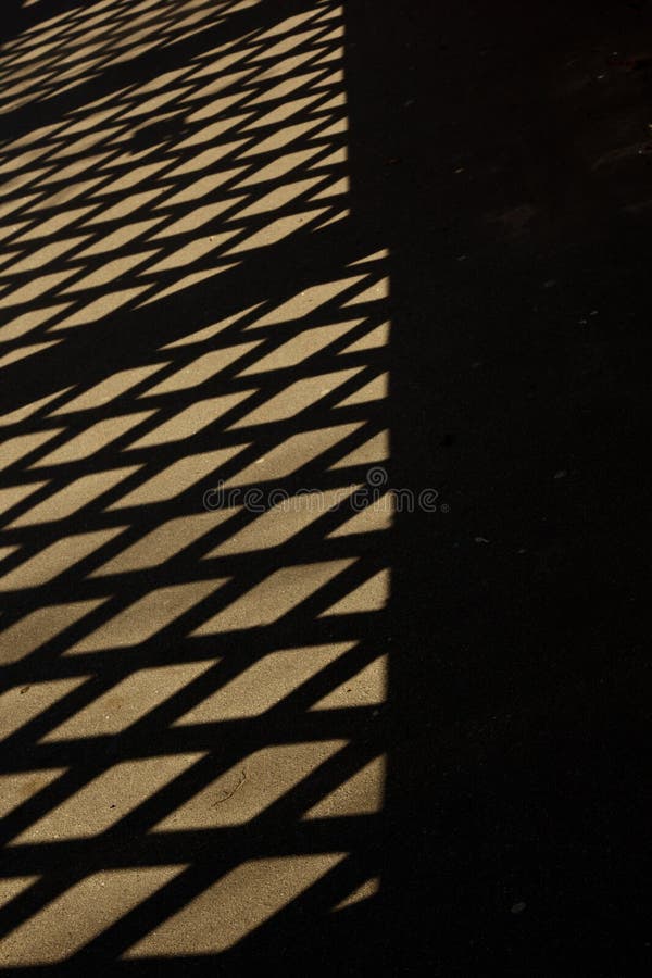 Geometric Shadows from the Grid on the Ground. View from Above Stock ...
