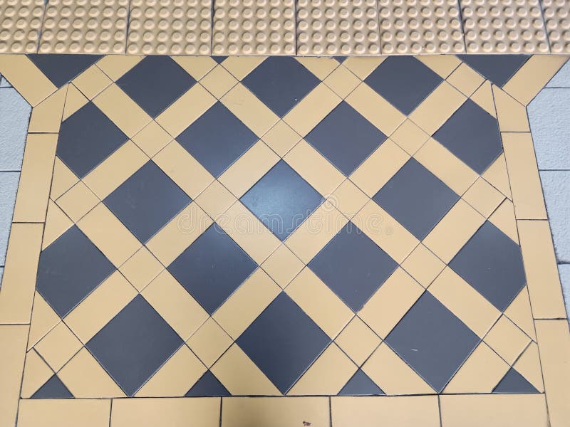 Geometric Tile Pattern with Checkerboard Design in Yellow and Gray Hues ...