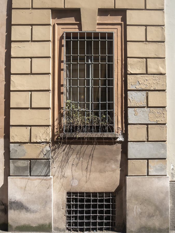Geometric Window Design Featuring Metal Bars and Brickwork a ...