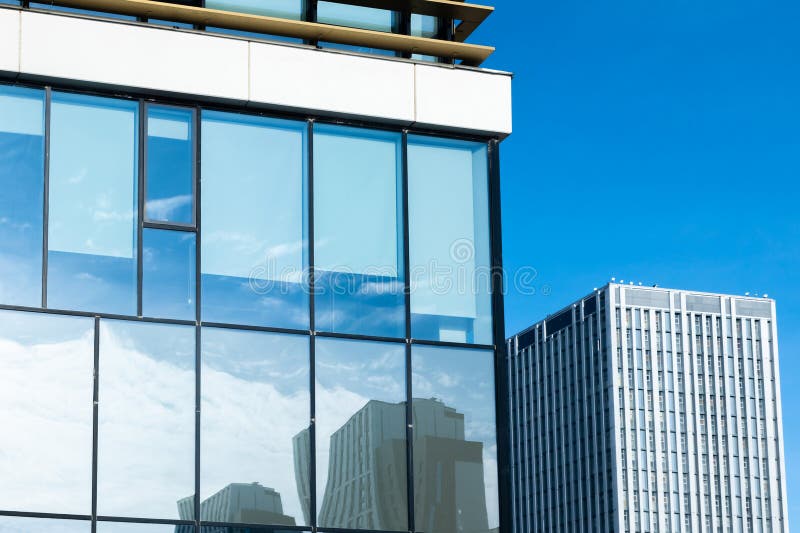 The Geometry of Modern Urban Architecture is Reflected in the Glass ...
