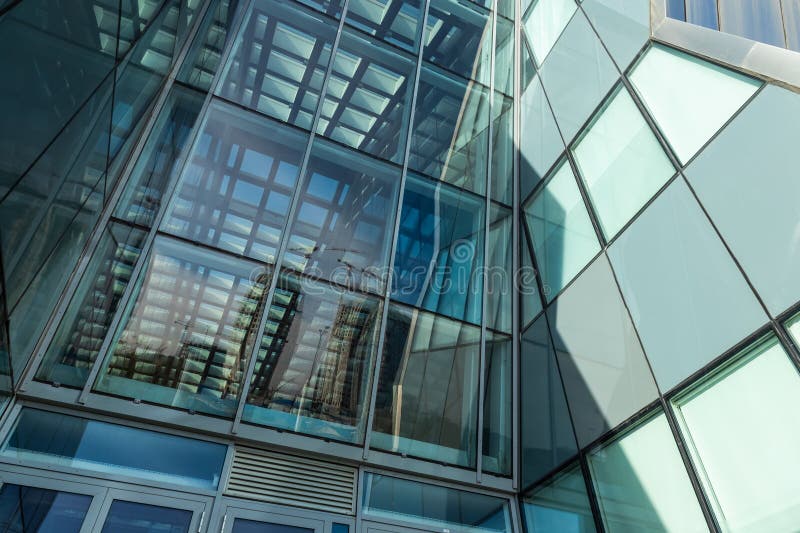 The Geometry of Modern Urban Architecture is Reflected in the Glass ...