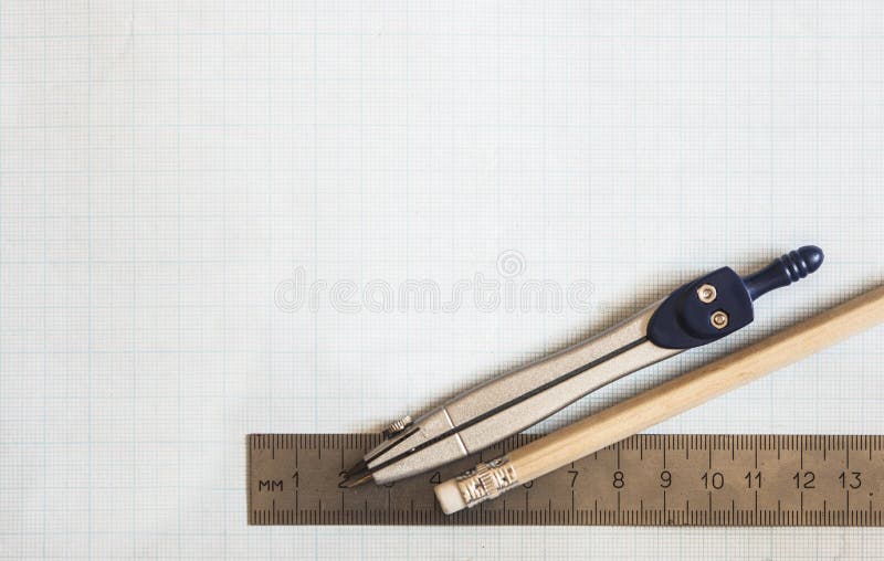 Pencil, Compass and Rulers on Graph Paper Background Stock Photo ...