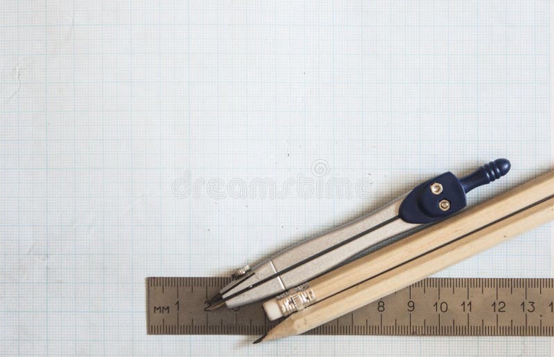 Pencil, Compass and Rulers on Graph Paper Background Stock Photo ...