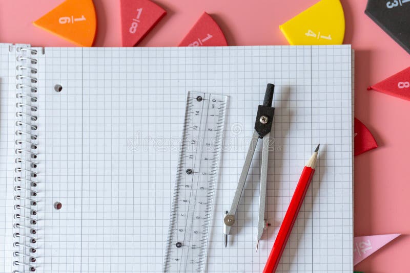 Geometry Set on Open Notebook. Compass Drawing Tool, Ruler, Pencils ...
