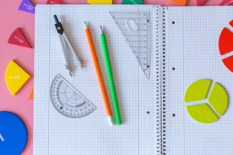 Geometry Set on Open Notebook. Compass Drawing Tool, Ruler, Pencils ...