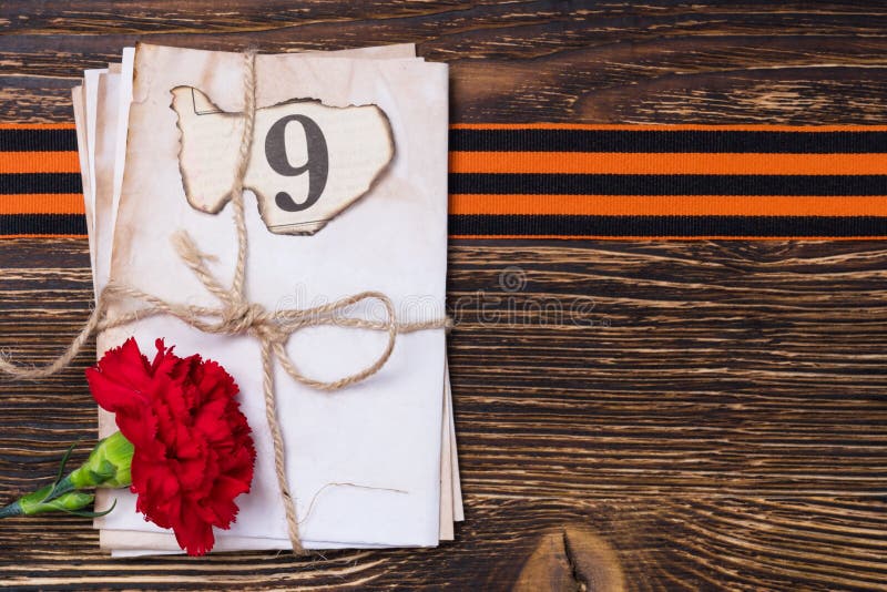 George Ribbon on the Blackboard Under Letters and a Red Flower Stock ...