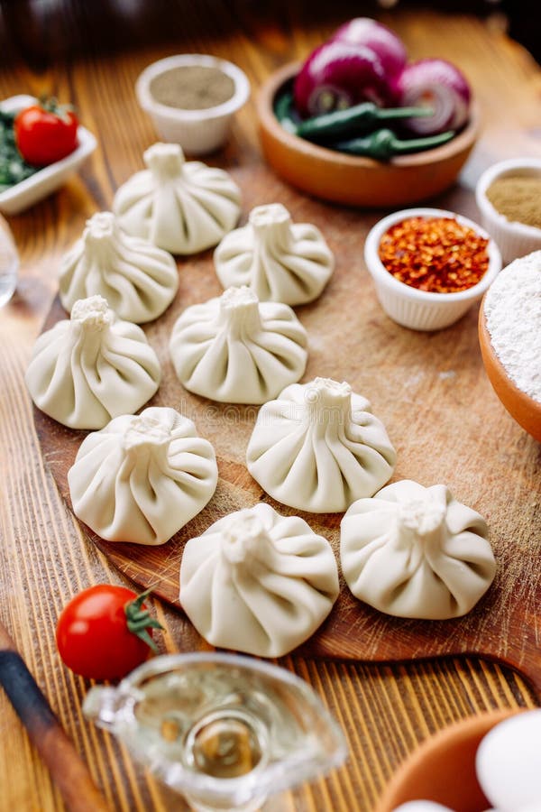 Georgian National Cuisine Khinkali, the Cooking Process. Top View of a ... Georgian National Cuisine Khinkali, the Cooking Process. Top View of a ...