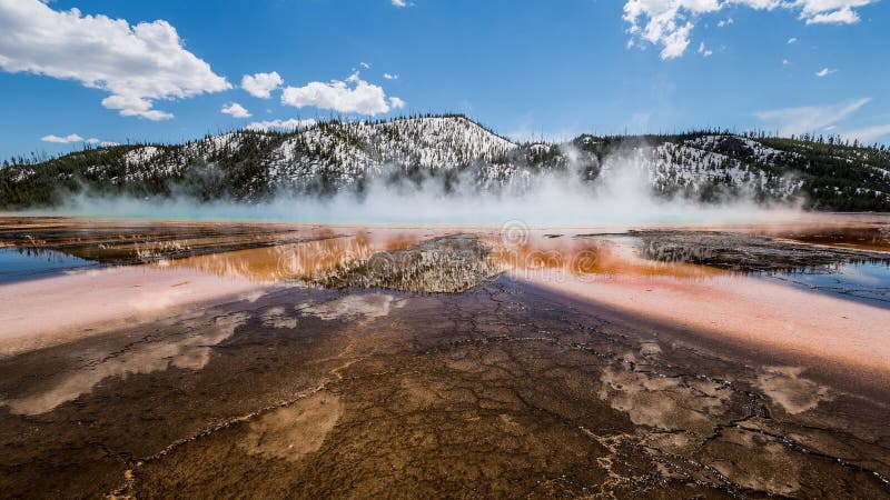 Geothermal Area with Steam and Snow - Capped Mountains Stock ...