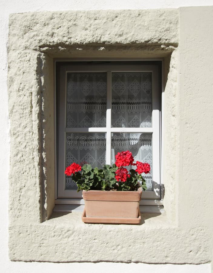 Geraniums at the window stock image. Image of exterior - 35427459