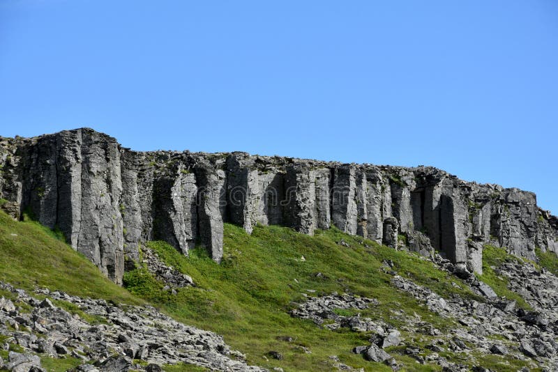 The Gerduberg Basalt Cliffs on the Green Hillside in Iceland Stock ...