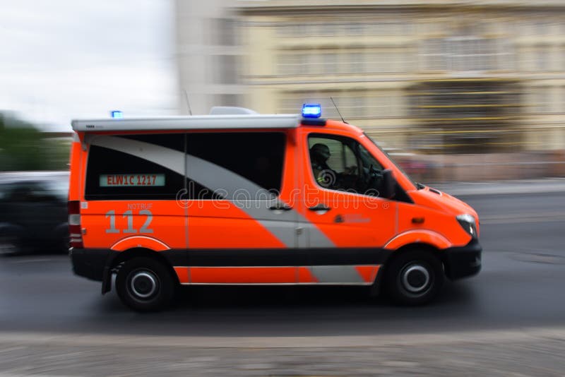 German Emergency Ambulance And Police Vehicle Stands On The Street ...