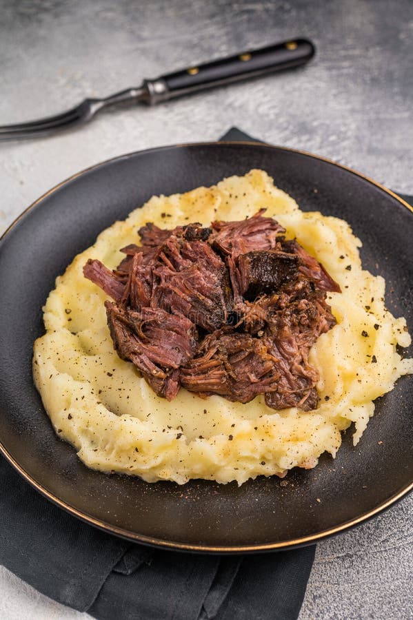 German Braised Beef Cheek, Slow Cooked Meat with Smashed Potatoes on a ...