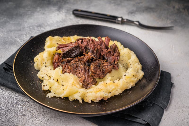 German Braised Beef Cheek, Slow Cooked Meat with Smashed Potatoes on a ...