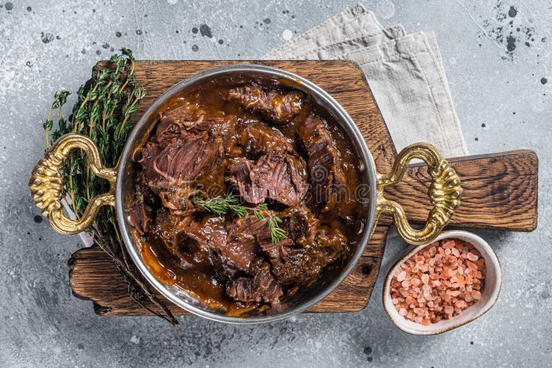 German Braised Beef Cheeks in Brown Red Wine Sauce. Gray Background ...