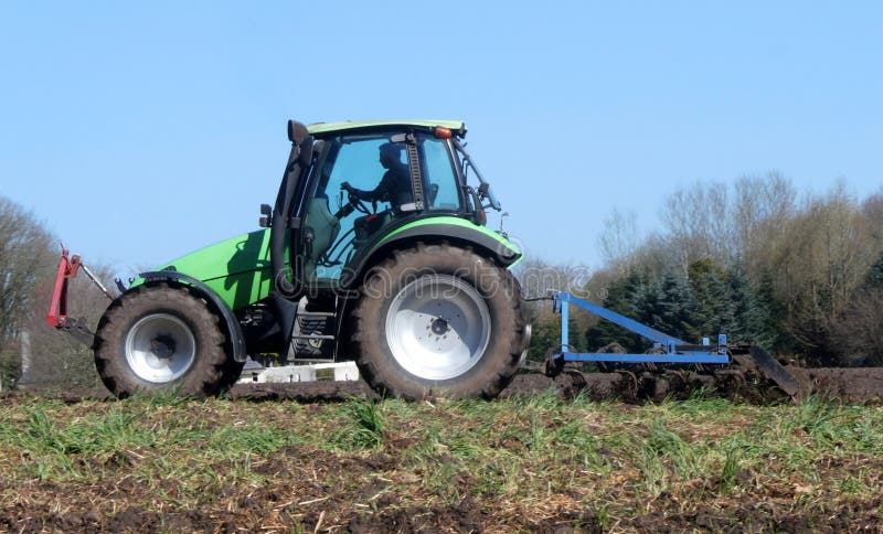 Tractor with plow stock photo. Image of mechanic, outdoor - 277129826