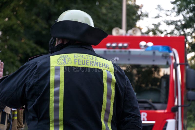 German Fireman at Work, Rear View Editorial Photography - Image of ...