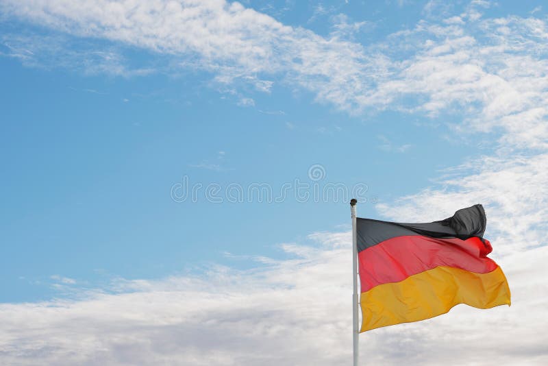 German Flag Against Blue Sky With Clouds Stock Photo - Image of country ...