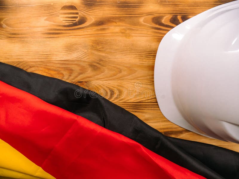 German Flag and Construction Helmet on a Tree. Concept Made in Germany ...