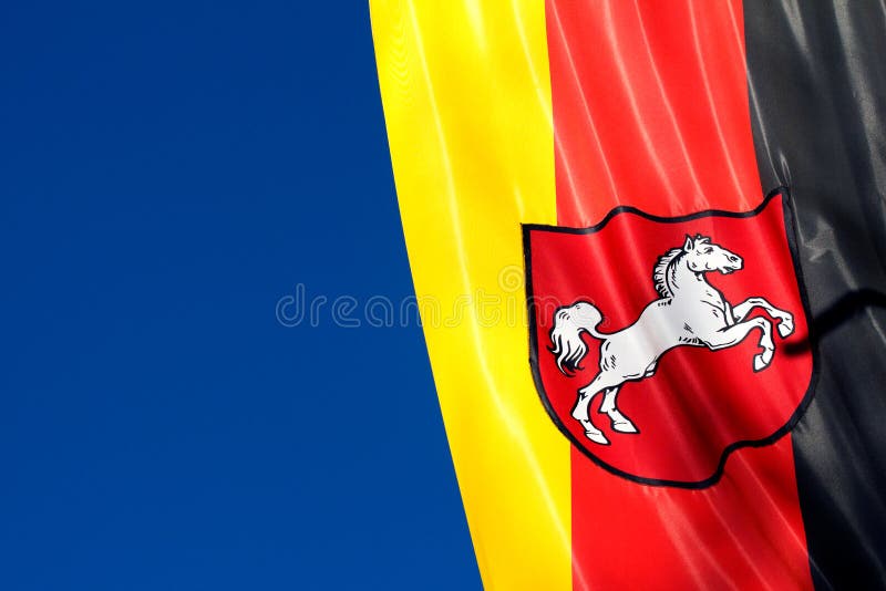 German Flag of Lower Saxony Against the Blue Sky Stock Image - Image of ...