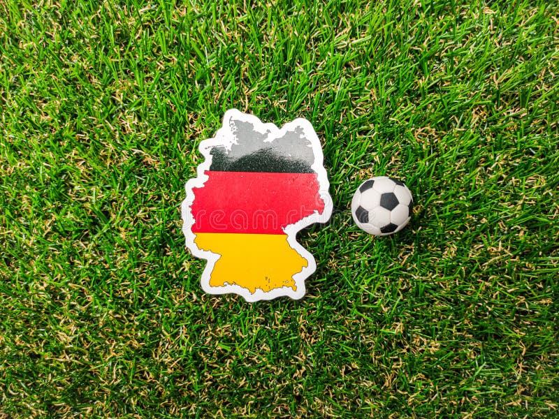 German Flag Sticker is on a Green Field. Stock Image - Image of trace ...