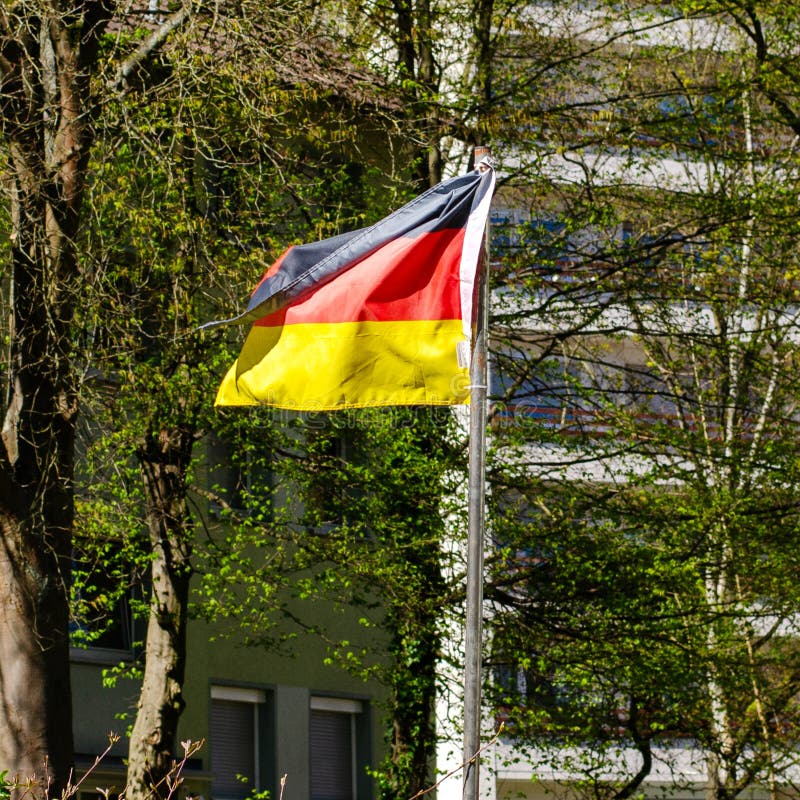 German Flag Waving in City Park Stock Photo - Image of waving, german ...