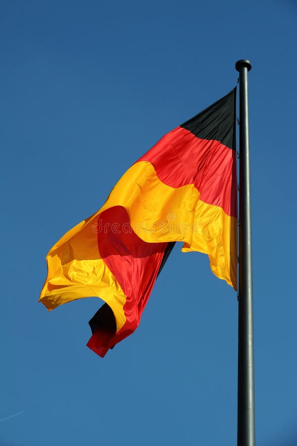 German flag in the wind stock photo. Image of flag, yellow - 146273826