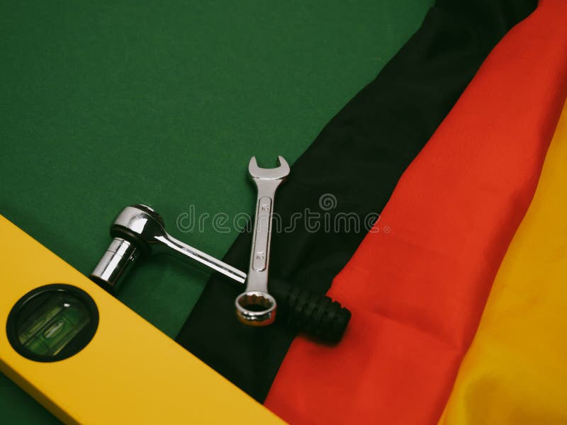 German Flag and Work Tool on Green. Concept Made in Germany Stock Photo ...