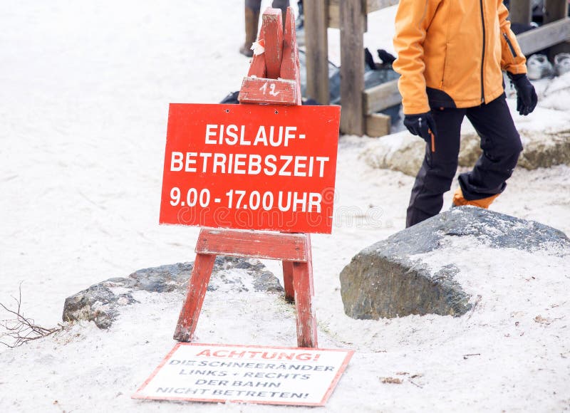 Austrian Ice Skating Area Sign with Schedule and Safety Warnings in ...