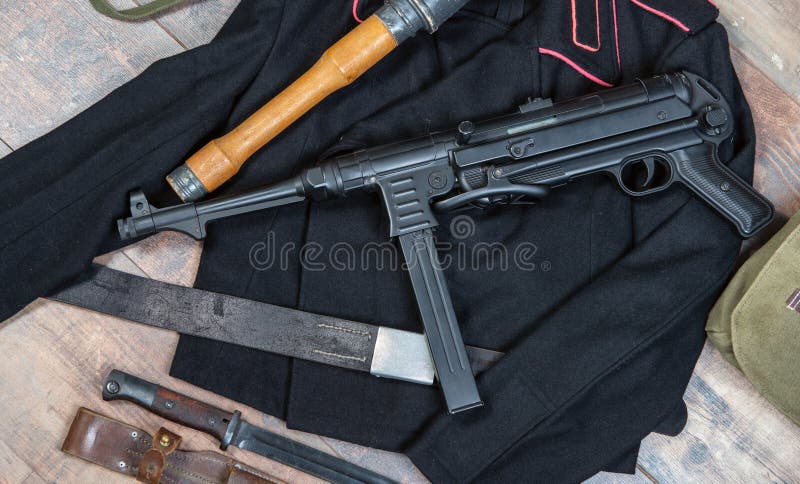 German Machine Gun is on a Table Next To a Knife. Scene is Tense and ...