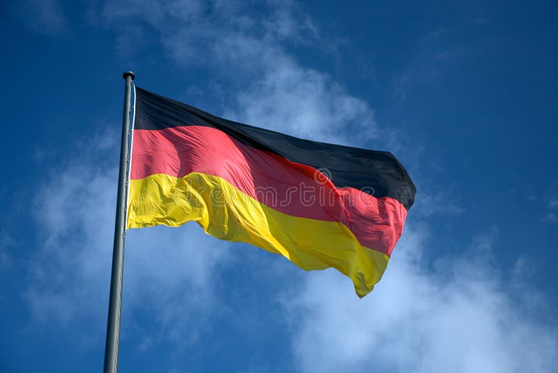 German National Flag Waving in the Breeze Stock Photo - Image of clouds ...