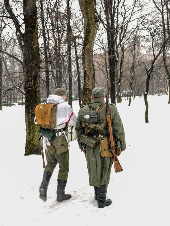 German Soldiers of World War II in a Snowy Forest, View from the Back ...
