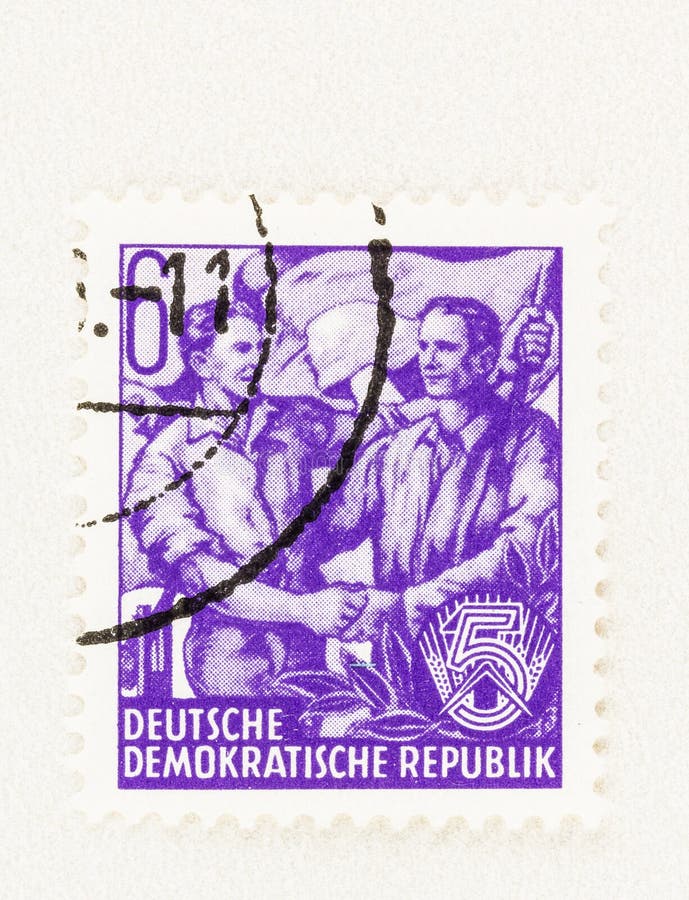 German and Soviet Workers on Purple DDR Postage Stamp Editorial Stock ...