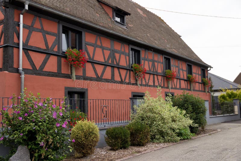 German-style House with a Red Wall in Alsace Stock Image - Image of ...