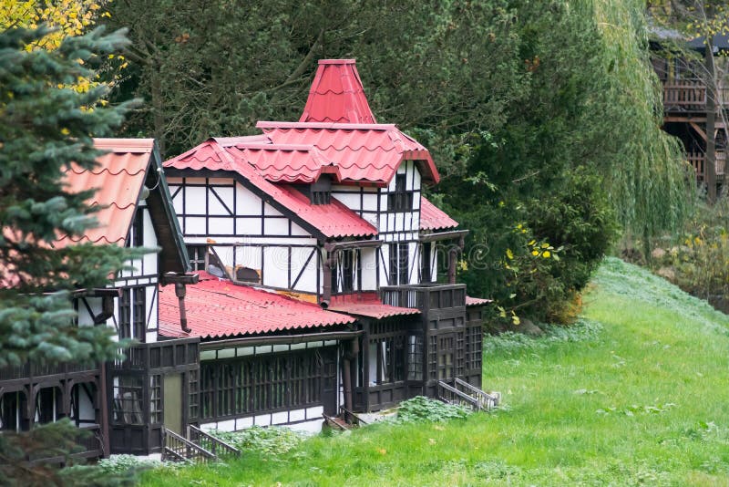 German Style Miniature House on Green Grass Stock Image - Image of ...