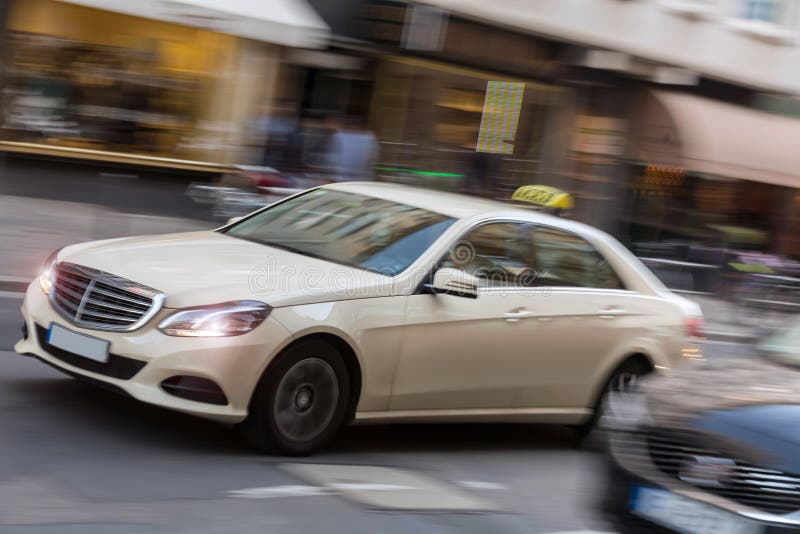 German Taxi Cab Speeding in the City Stock Image - Image of blur, sign ...