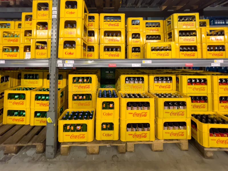 Germany Berlin May 11, 2024. a Large Stack of Yellow Boxes of Coca-Cola ...
