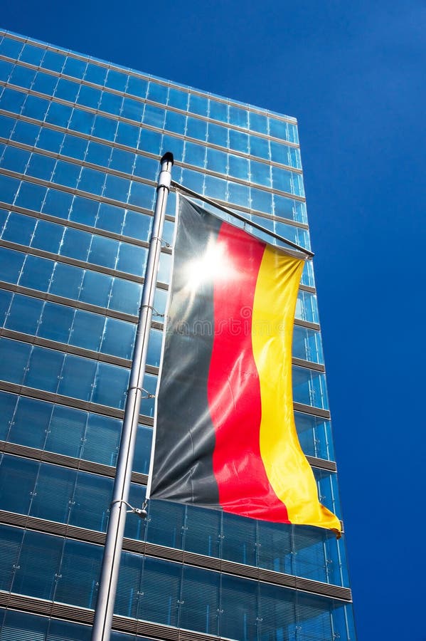 Germany flag in a blue sky stock image. Image of cooperation - 5110789