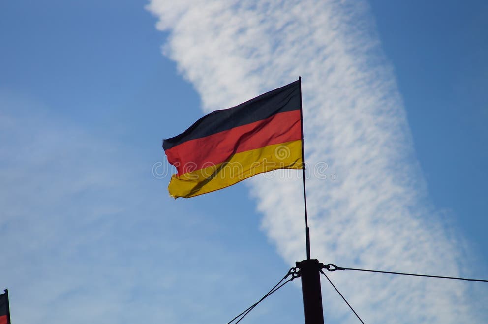 Germany Flag Waving in Front of a Contrail Stock Image - Image of skies ...