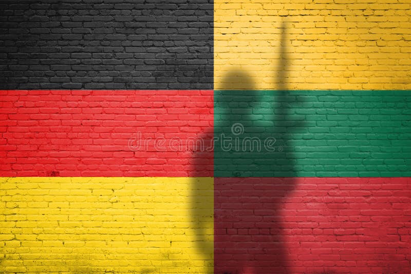 Flags Germany and Lithuania Painted on Brick Wall with Soldier Shadow ...