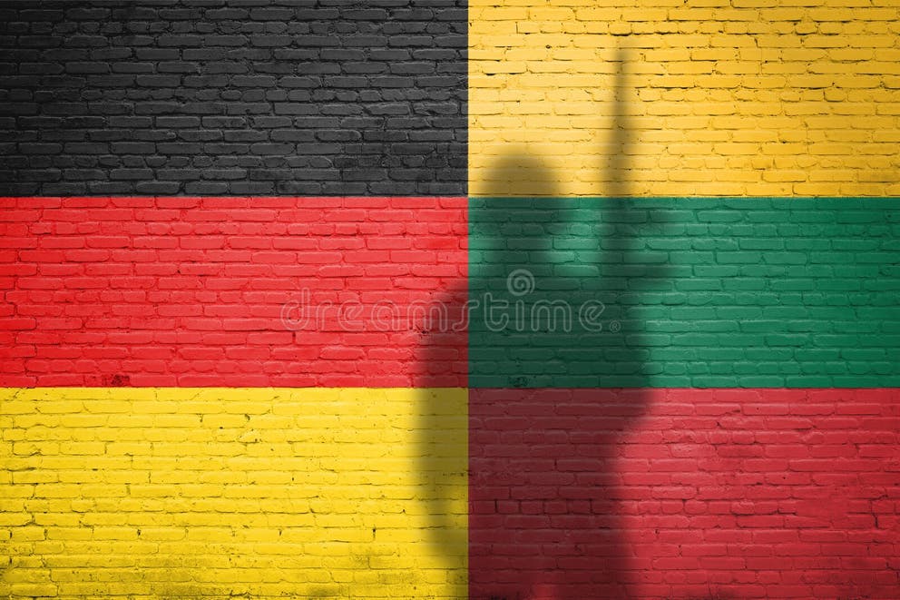 Flags Germany and Lithuania Painted on Brick Wall with Soldier Shadow ...