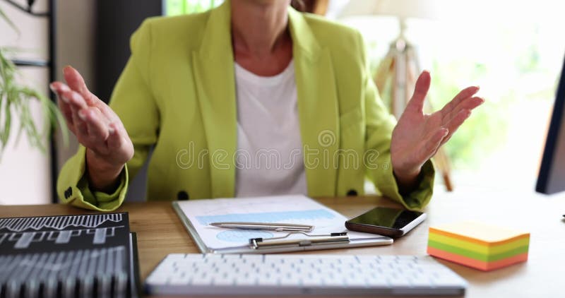 Gesticulating with Hands of Talking Woman Sitting at Table Stock Video ...