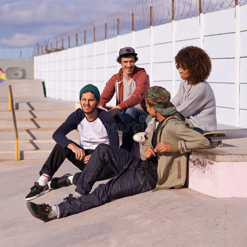 Get Back on Your Boards. a Group of Friends Hanging Out at a Skate Park ...