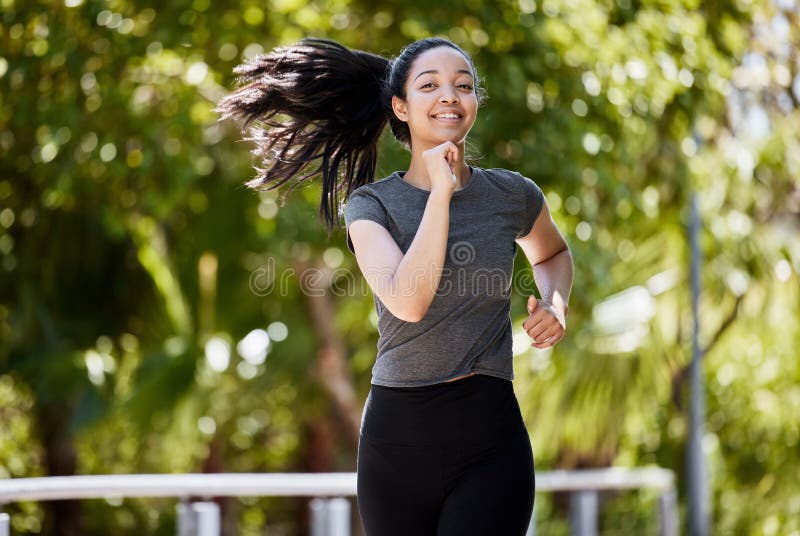 Get Going, Get the Blood Flowing. a Young Woman Going for a Run in the ...